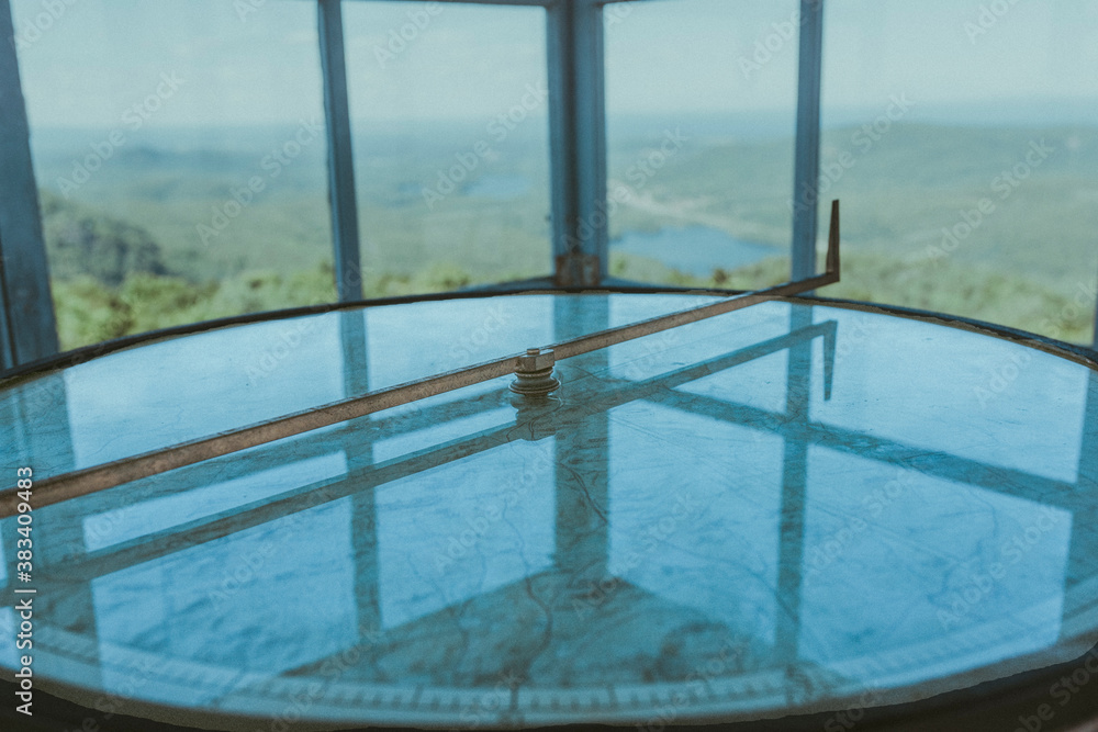Adirondack fire tower with old compass and map with views of the ...
