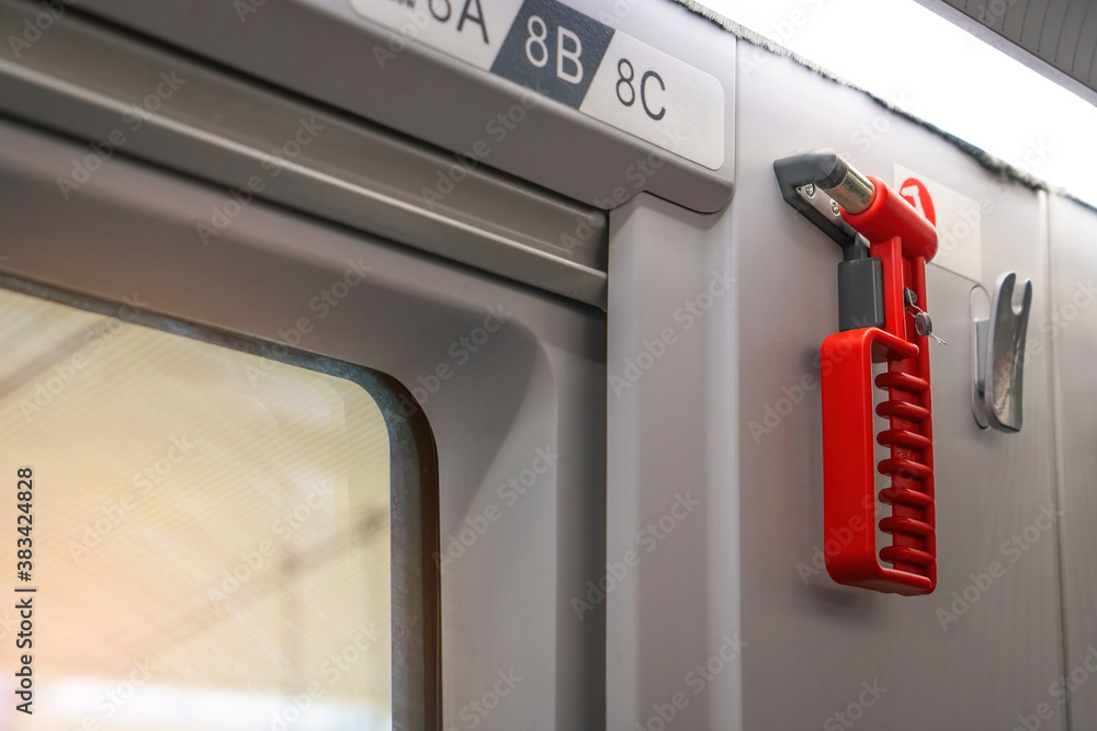 Hammer glass breaker on the train, tram, bus and car. Red safety glass ...