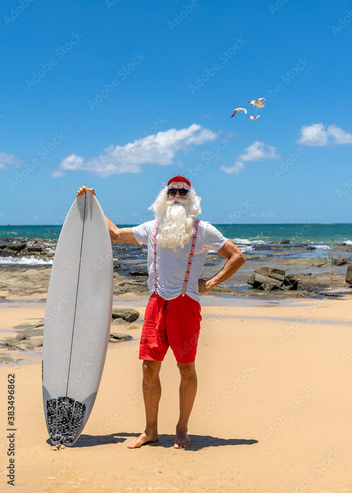 Santa Claus with a surf board with the ocean on backgraund. Australia ...