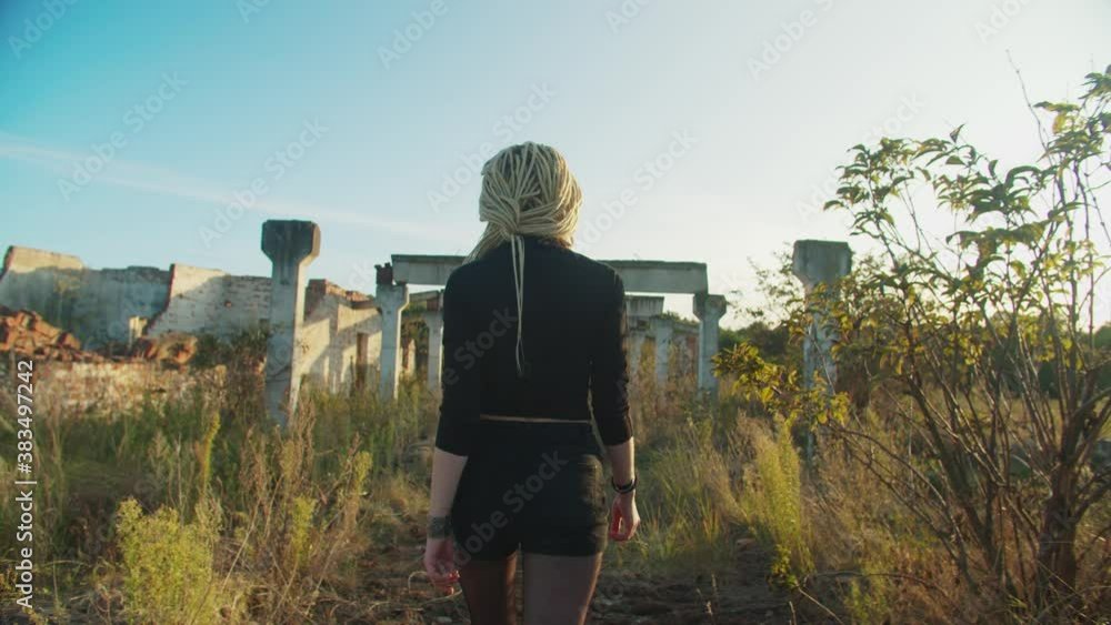 Stockvideon Rear view of slim attractive bloodthirsty female vampire ...