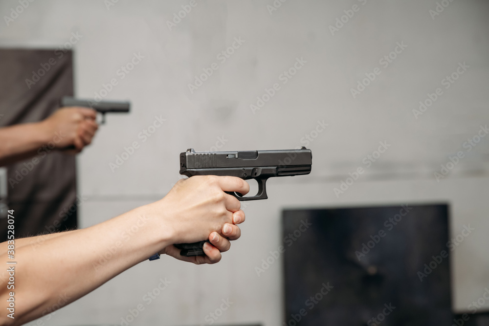 Shooting range. People shoot with gun at a shooting range Stock-Foto ...