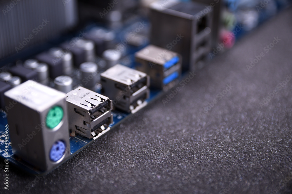 Slots for connection on the motherboard close up USB Ethernet keyboard ...