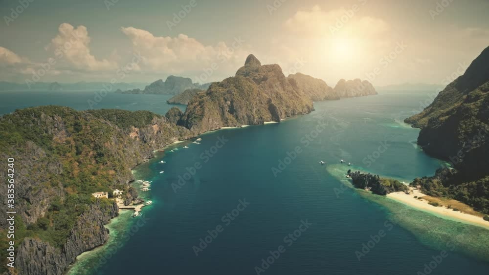 Sun shine over tropic mountainous islands at ocean bay aerial view ...