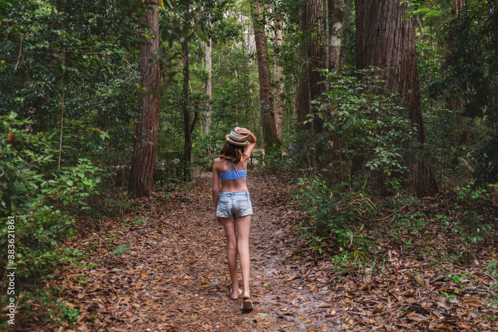 young teen walking in the forest in summer Stock Photo | Adobe Stock