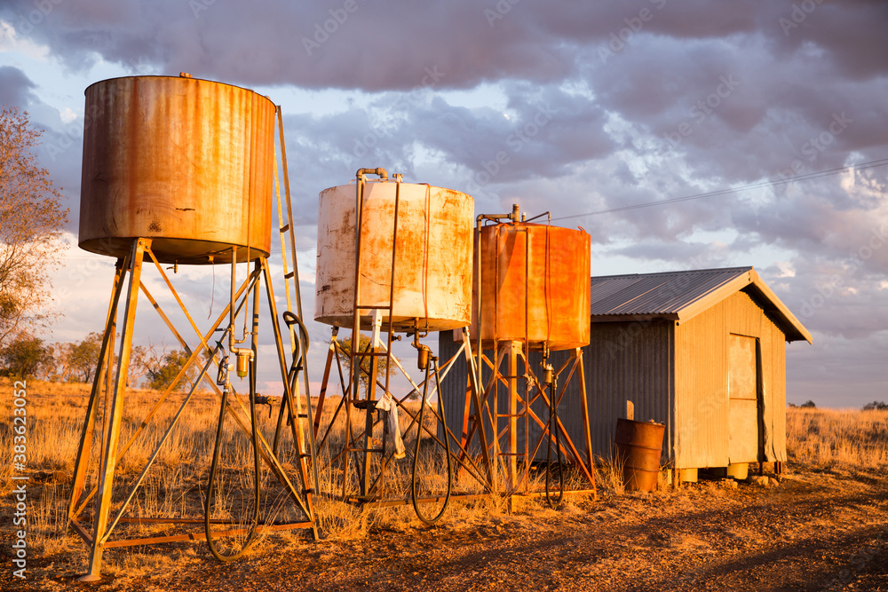 Fuel Bowsers on a farm with shed Stock Photo | Adobe Stock