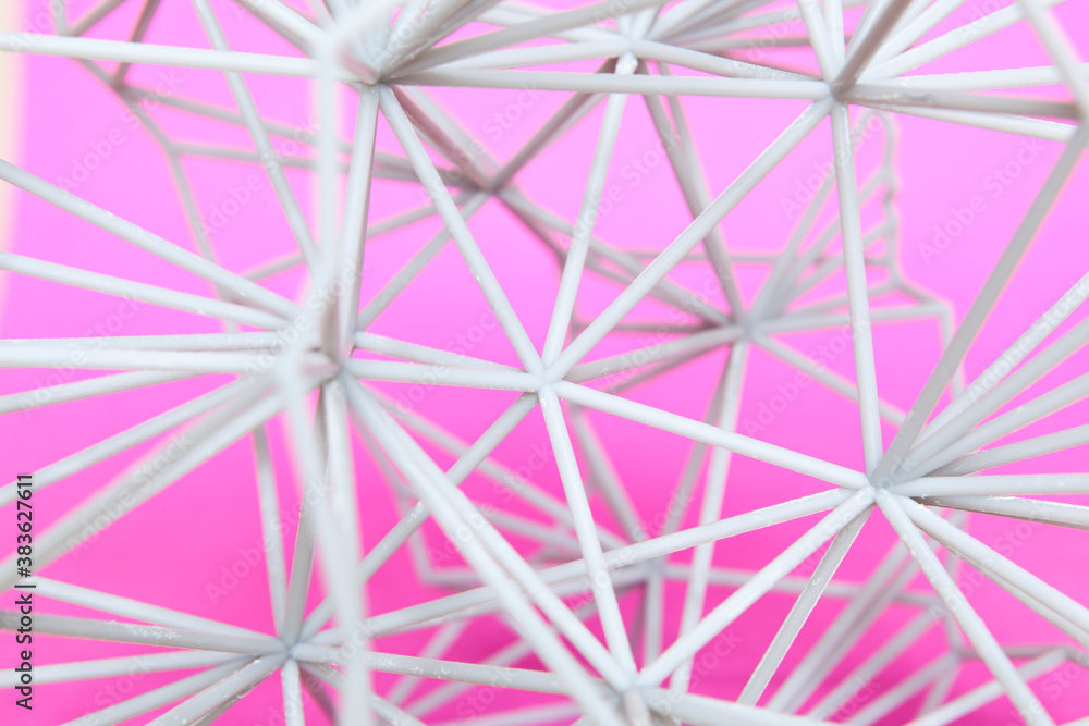 3D printed structure. Networked structure against a pink background ...