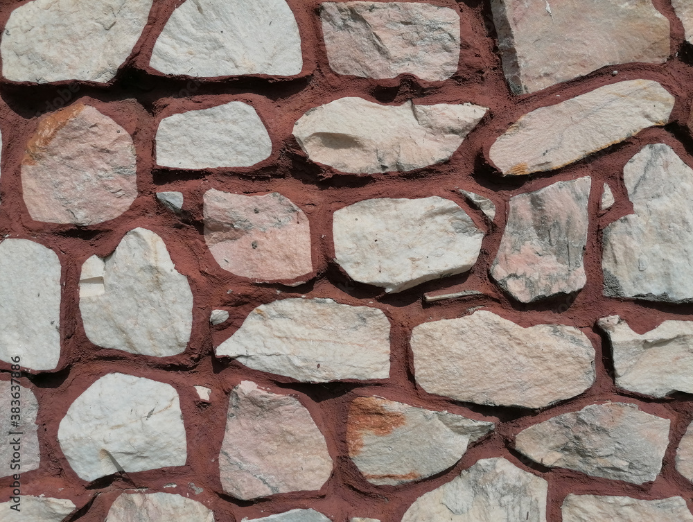 Wall with masonry, with elements of chestnut color. Beautiful texture ...