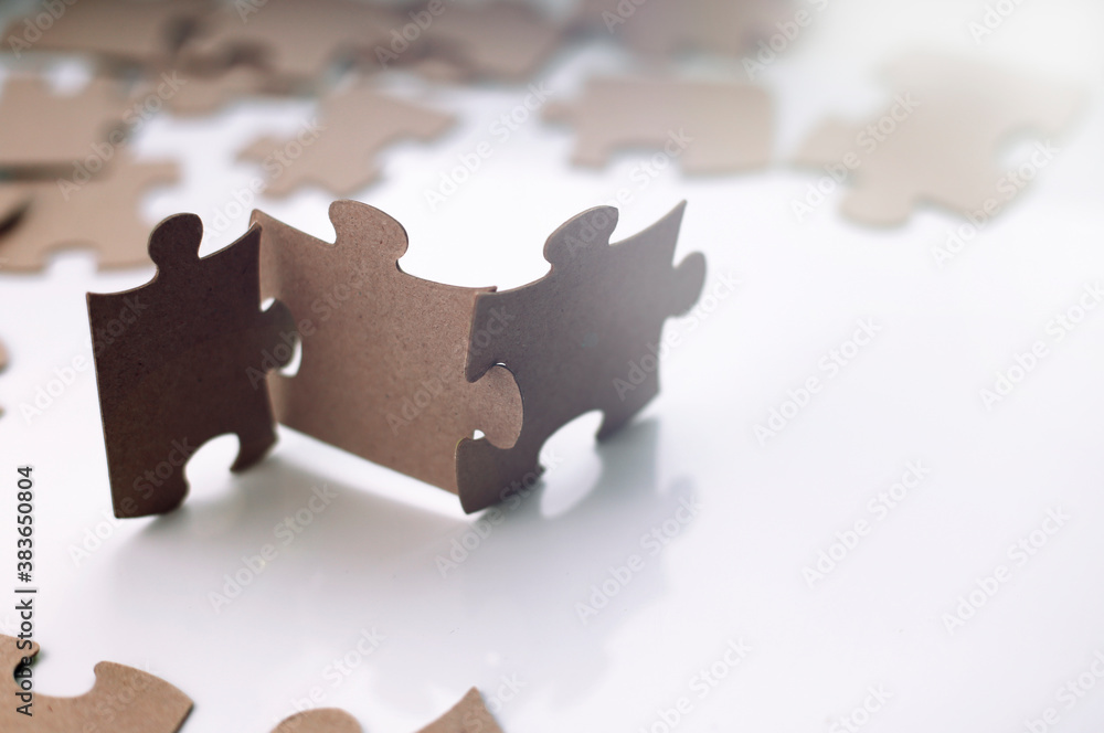 Teamwork concept. Three pieces of the puzzle are connected together ...