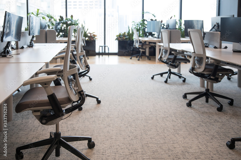 Office with a view of the cityscape from the near by window with plenty ...