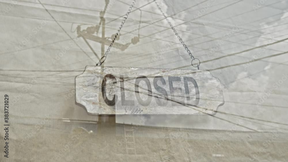 A sign hanging on a door with a glass window with the inscription ...