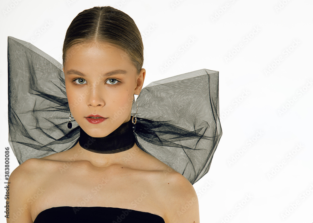 Fashion close-up Portrait in the Studio of a beautiful young girl with ...