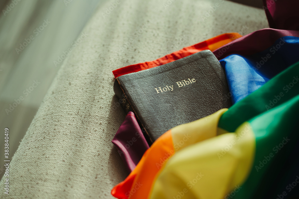 The Holy Bible on rainbow flags, which are the colors that the ...