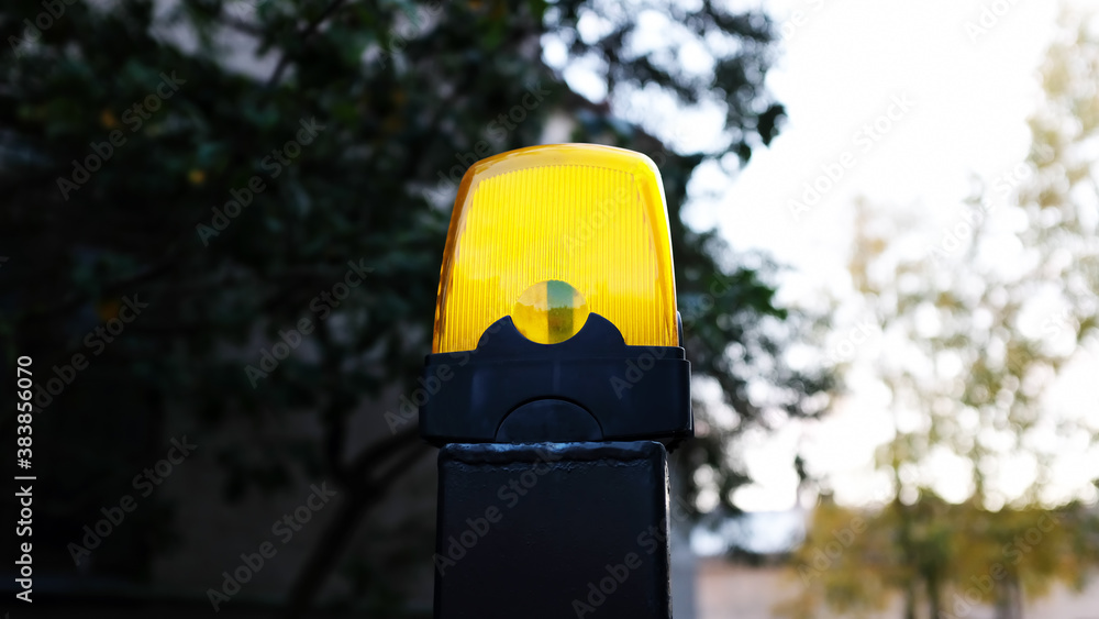 yellow warning light on the gate of the house Stock Photo | Adobe Stock