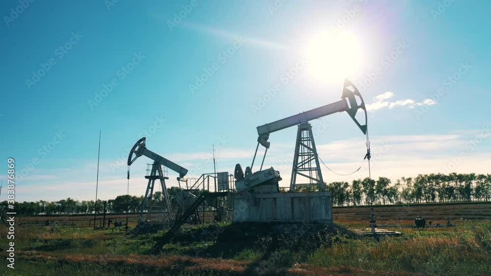 Oil development site with functioning pumping units. Oil well, crude ...