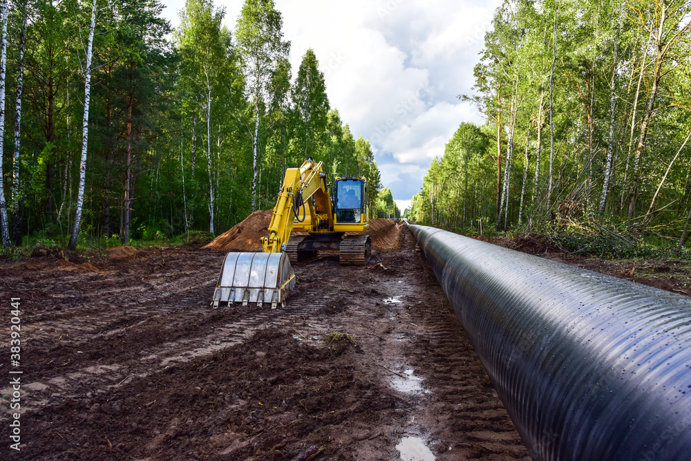 Stockfoto Excavator during earthwork for laying Crude oil and Natural ...
