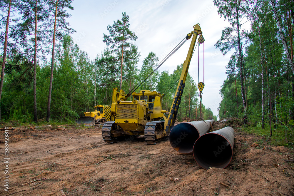 Pipelayer with side boom Installation of gas and crude oil pipes in ...