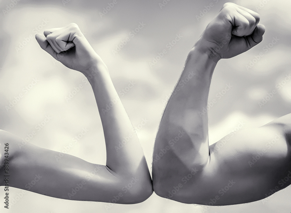 Foto de Muscular arm vs weak hand. Vs, fight hard. Competition ...