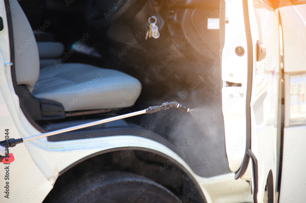 Virologist man wearing PPE kits spraying alcohol,disinfectant spray on ...