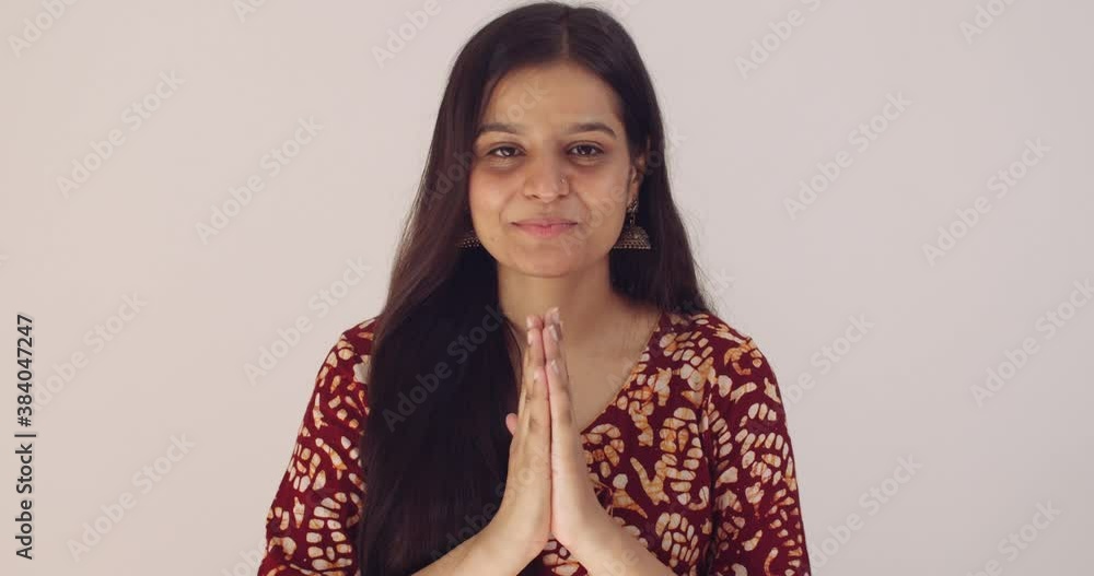 Indian woman welcomes greet goodbyes with hand joining Namaste greeting ...