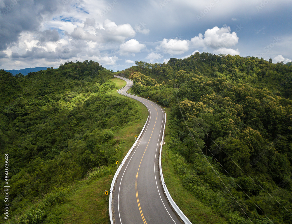 Aerial view of beautiful steep curved road (look like number 3) on the ...