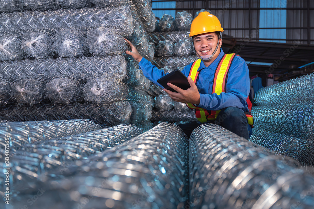 Cargo Inspection worker Rolls of steel wire mesh for construction work ...