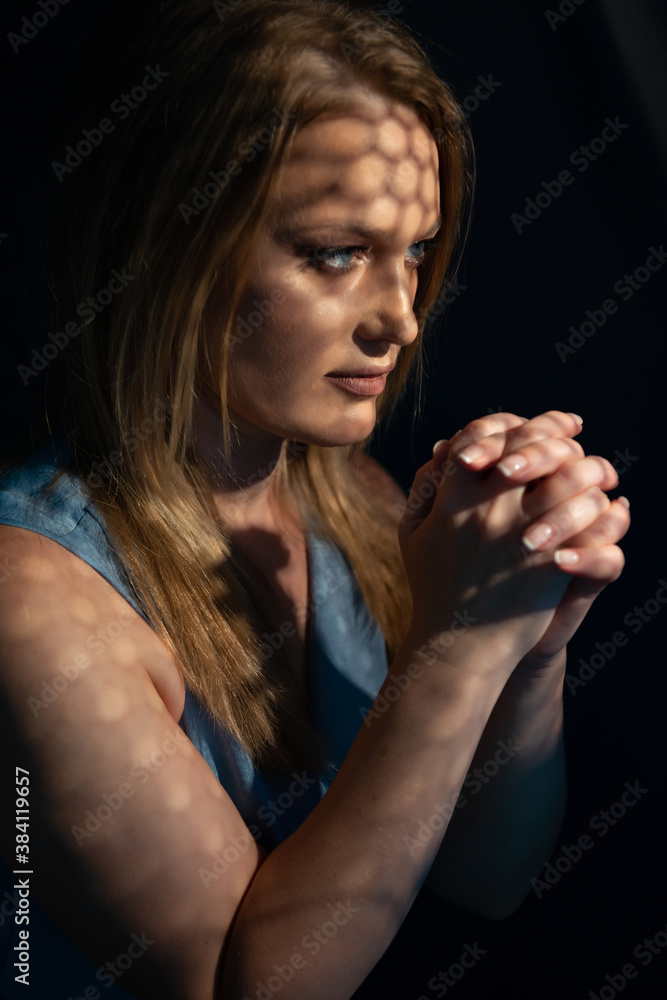 Beautiful woman confesses in the confessional. Praying woman, fine art ...