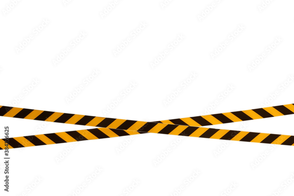 Black and yellow warning lines of barrier tape prohibit passage ...
