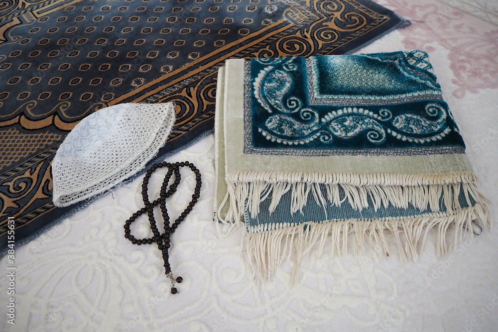 Worship tools and materials, prayer rug, rosary and skullcap in islam ...