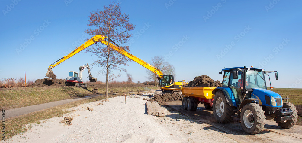 Dike reenforcement in The Netherlands: a tractor with tipper trailer ...