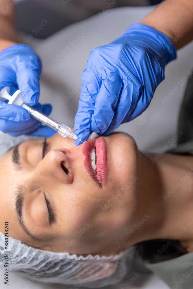 Beautiful, attractive, young woman, lying relaxed in dermatologist ...