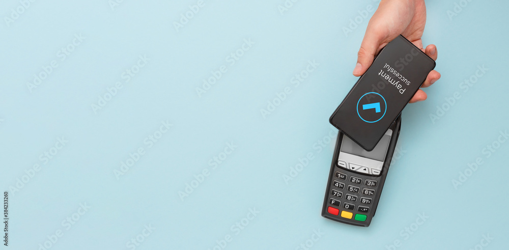 Contactless payment with smart phone. Stock Photo | Adobe Stock
