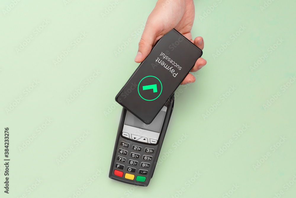 Contactless payment with smart phone. Stock Photo | Adobe Stock