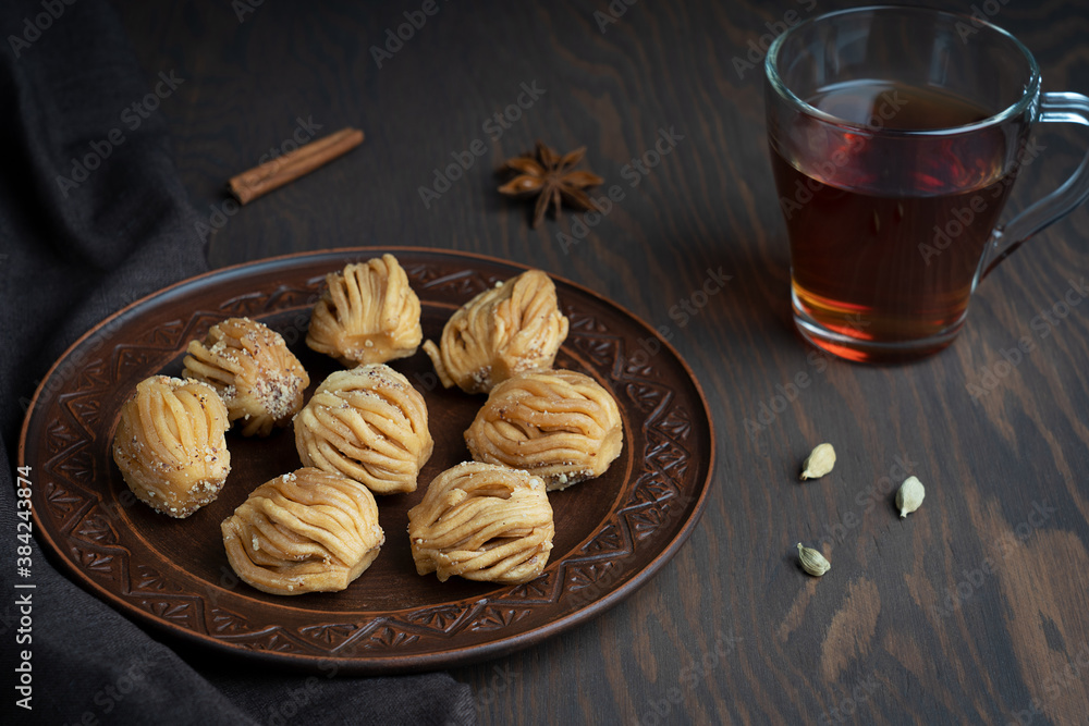 Indian local homemade sweet cookies named Jagannath in sugar syrup with ...