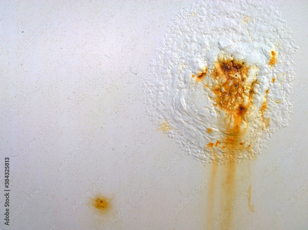 Sheet metal corrosion of an old white car. Rusty messy surface. Damaged ...