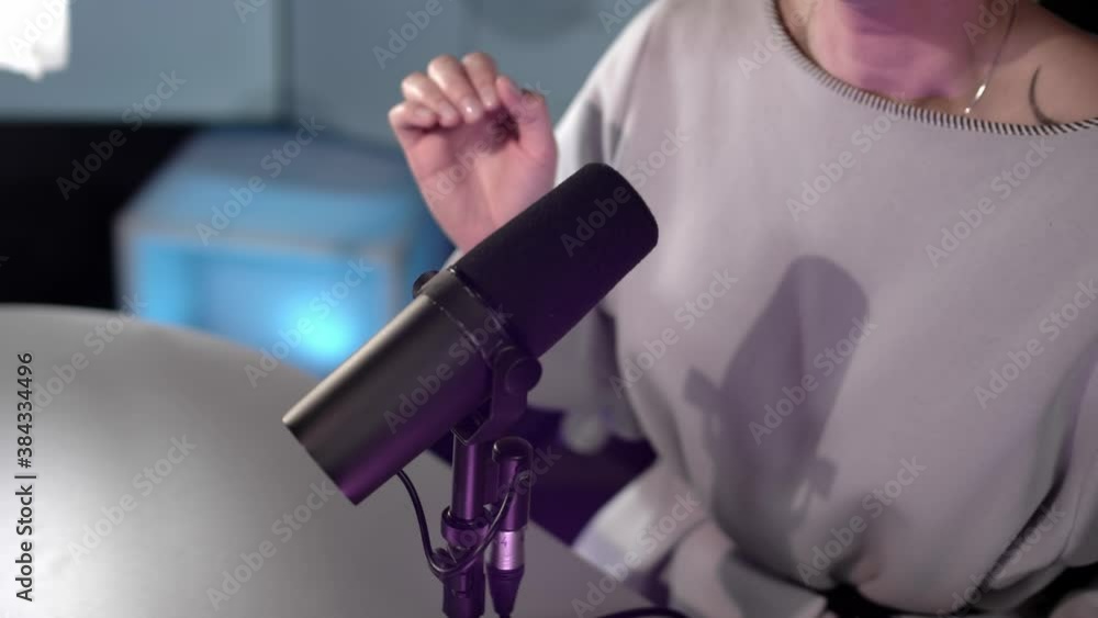 The evening news presenter sets up the microphone. Begins to tell ...