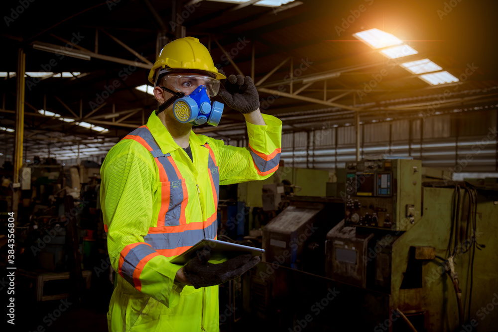 Engineer industry wearing safety uniform ,black gloves and gas mask ...