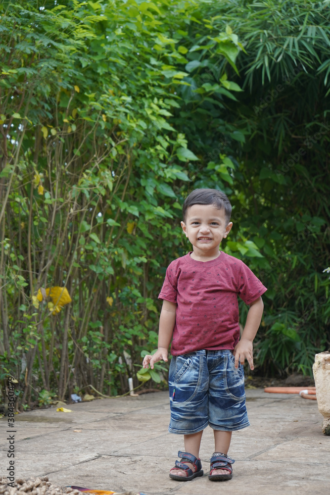 Cute Kid Best Standing smiling pose with nature Stock Photo | Adobe Stock