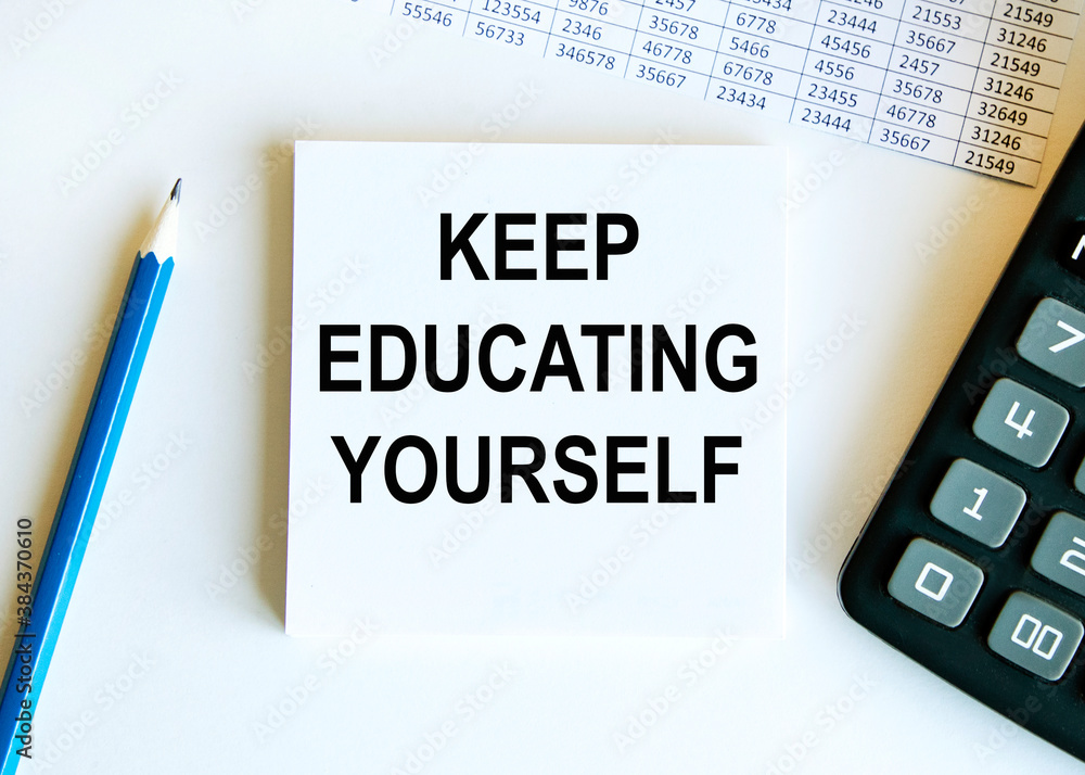 In the notebook is THE KEEP EDUCATING YOURSELF, next to the pencil ...