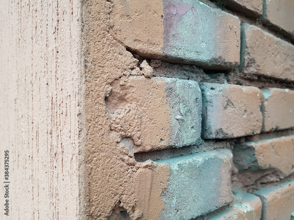 Corner joint between old brick and new concrete walls. Stock Photo ...