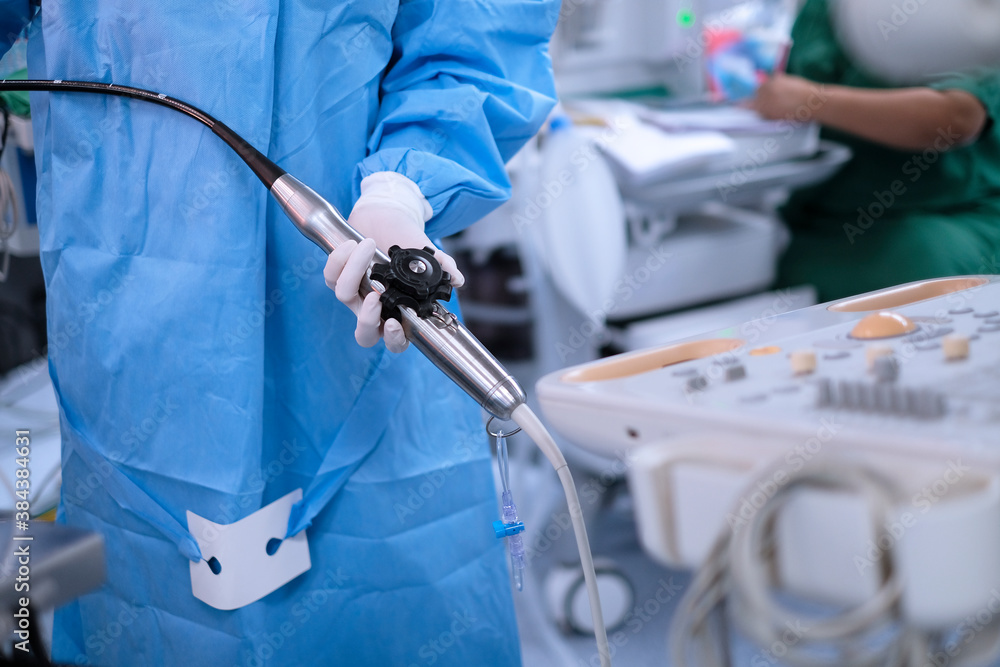 Cardiologist holding transesophageal ultrasound probe and use ...