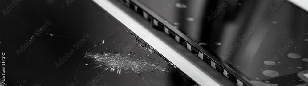 Repair of mobile devices. Broken touchscreen display of a black ...
