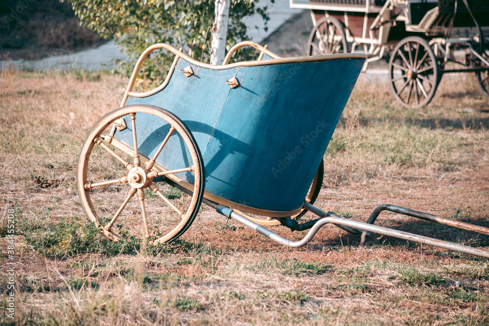 Blue ancient chariot with yellow wheels Stock Photo | Adobe Stock