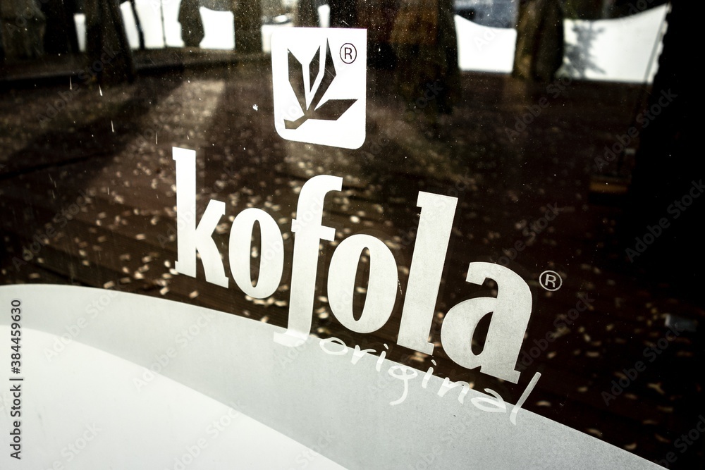 Logo of Kofola beverage company on a glass window of a Czech restaurant ...