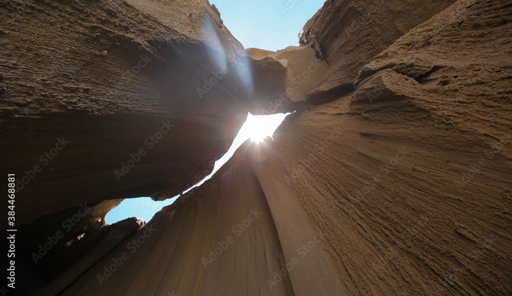 Light streams between two rocks near Salar de Uyuni in Bolivia Stock ...