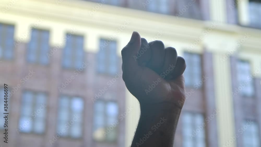 Black lives Matter. Black hand clenched in a fist in protest against ...