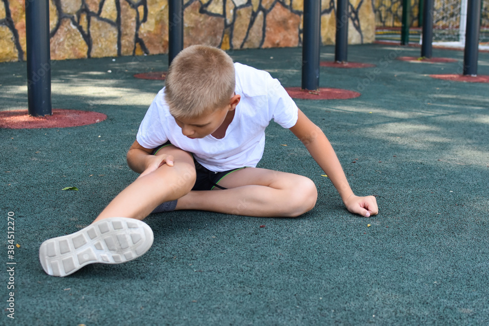 a sports boy was injured on the outdoor playground. safety measures on ...