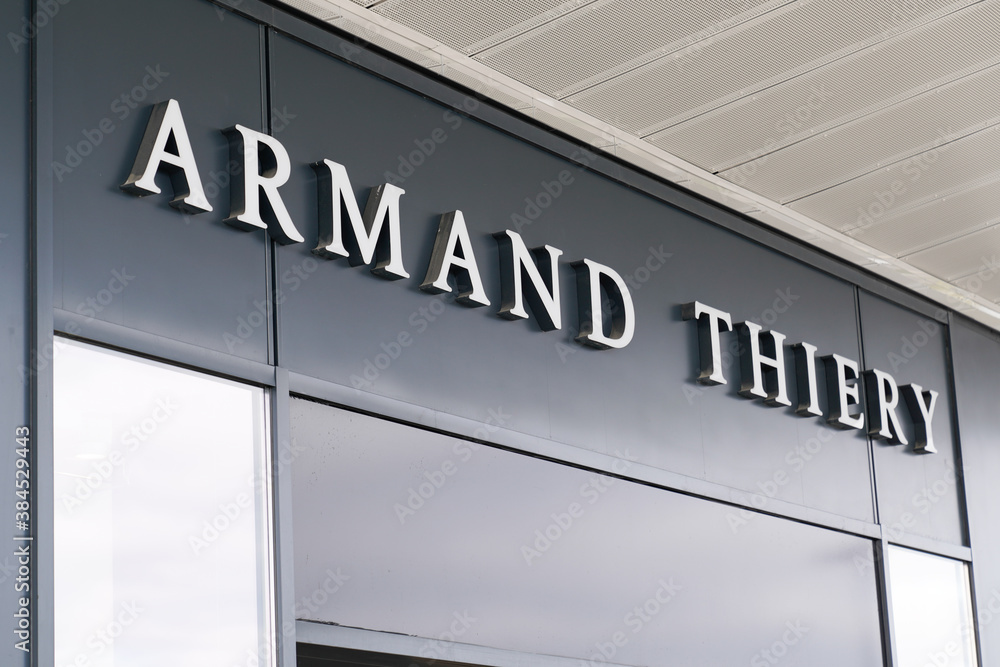 armand Thierry logo and sign text front of facade of clothing shop in ...