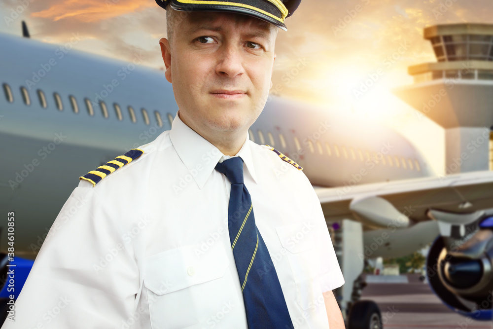 Airplane captain pilot in uniform at the airport Stock Photo | Adobe Stock