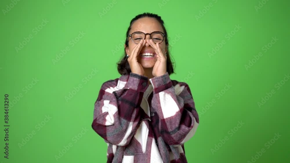 woman shouting and announcing something on green screen chroma key ...