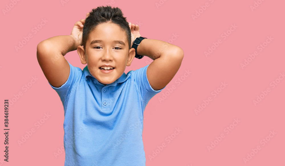 Little boy hispanic kid wearing casual clothes posing funny and crazy ...